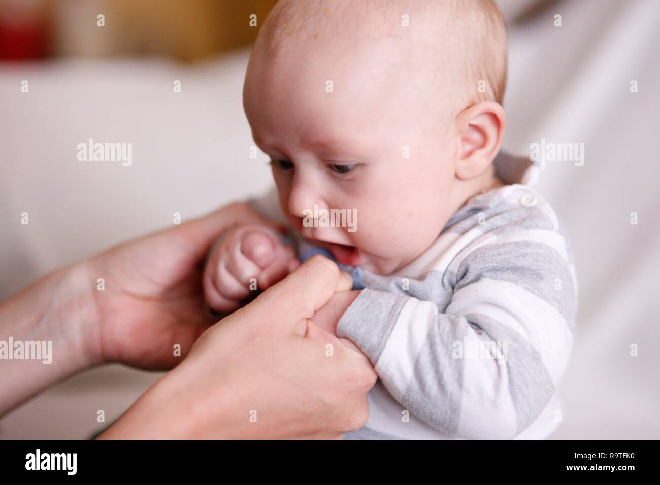 Newborn baby resting relaxed face up on Stock Photo - Alamy