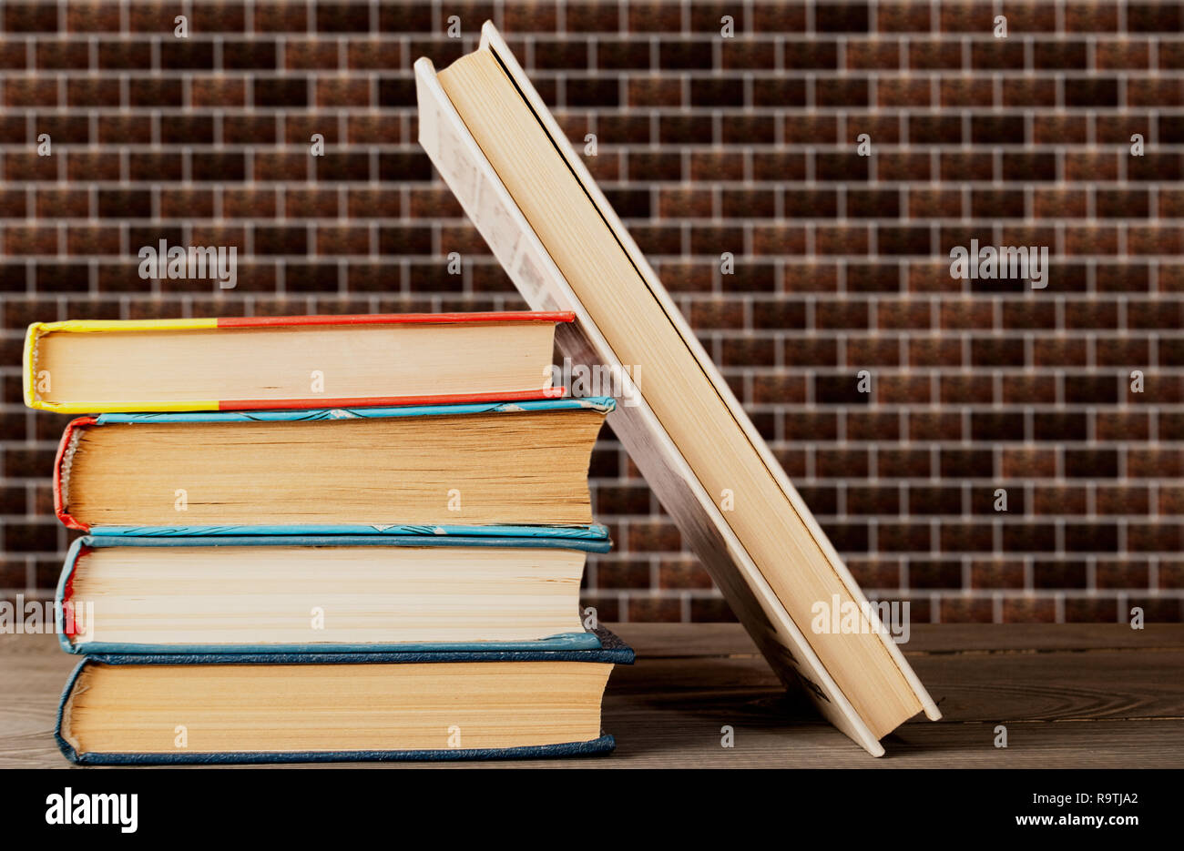 Row of old books vertical hi-res stock photography and images - Alamy