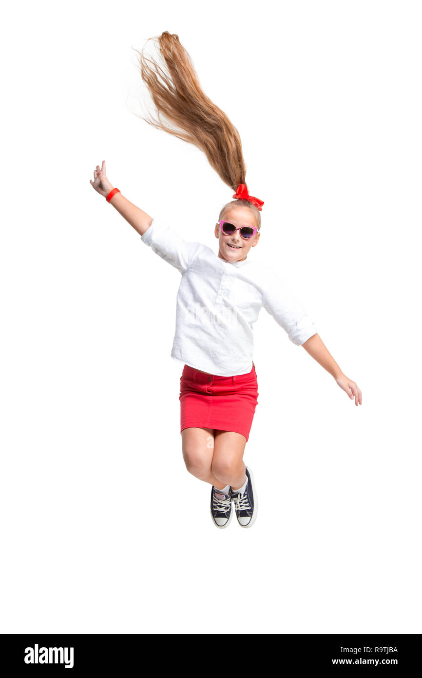Cute little girl jump. Studio shot. White background. Kids fashion ...