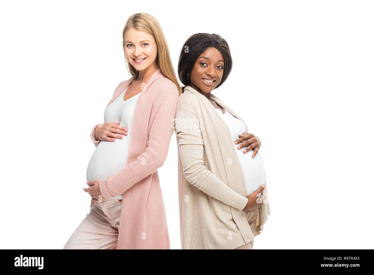 multicultural smiling pregnant women looking at camera isolated on ...