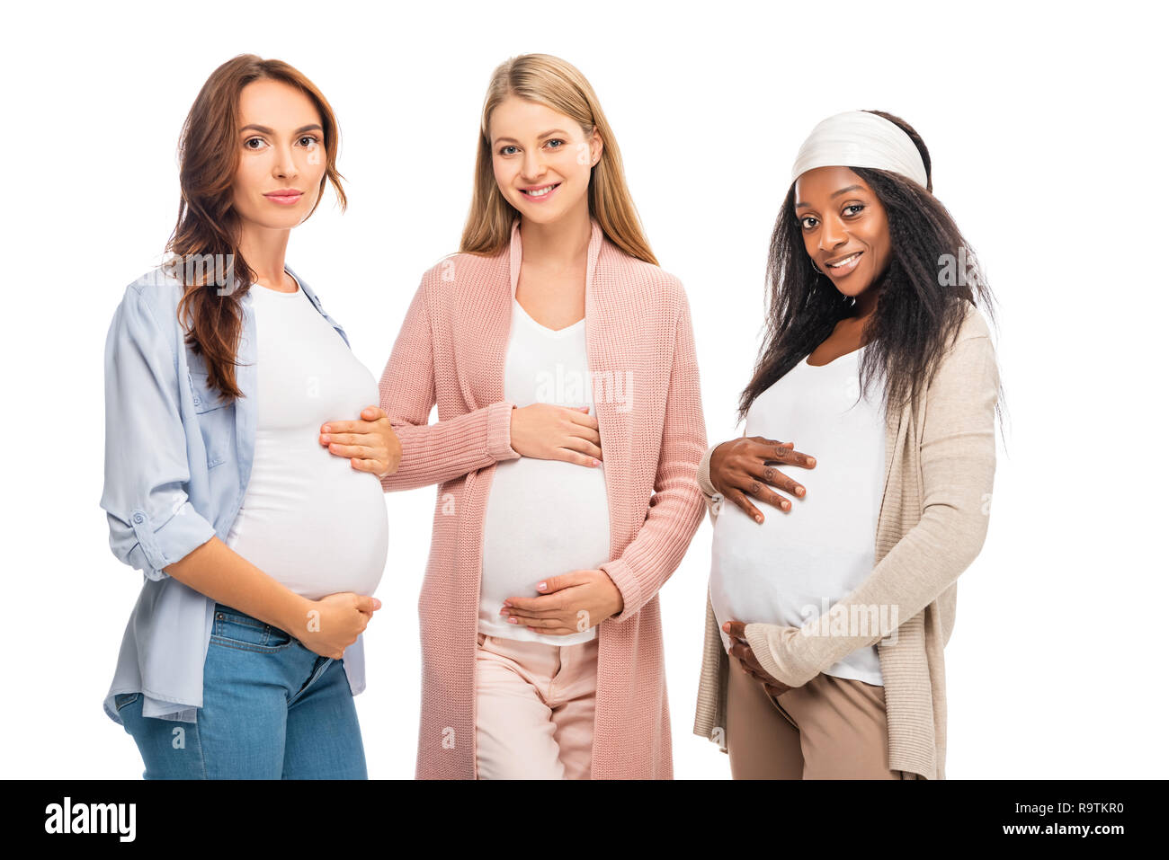 multiethnic pregnant women standing together isolated on white Stock ...