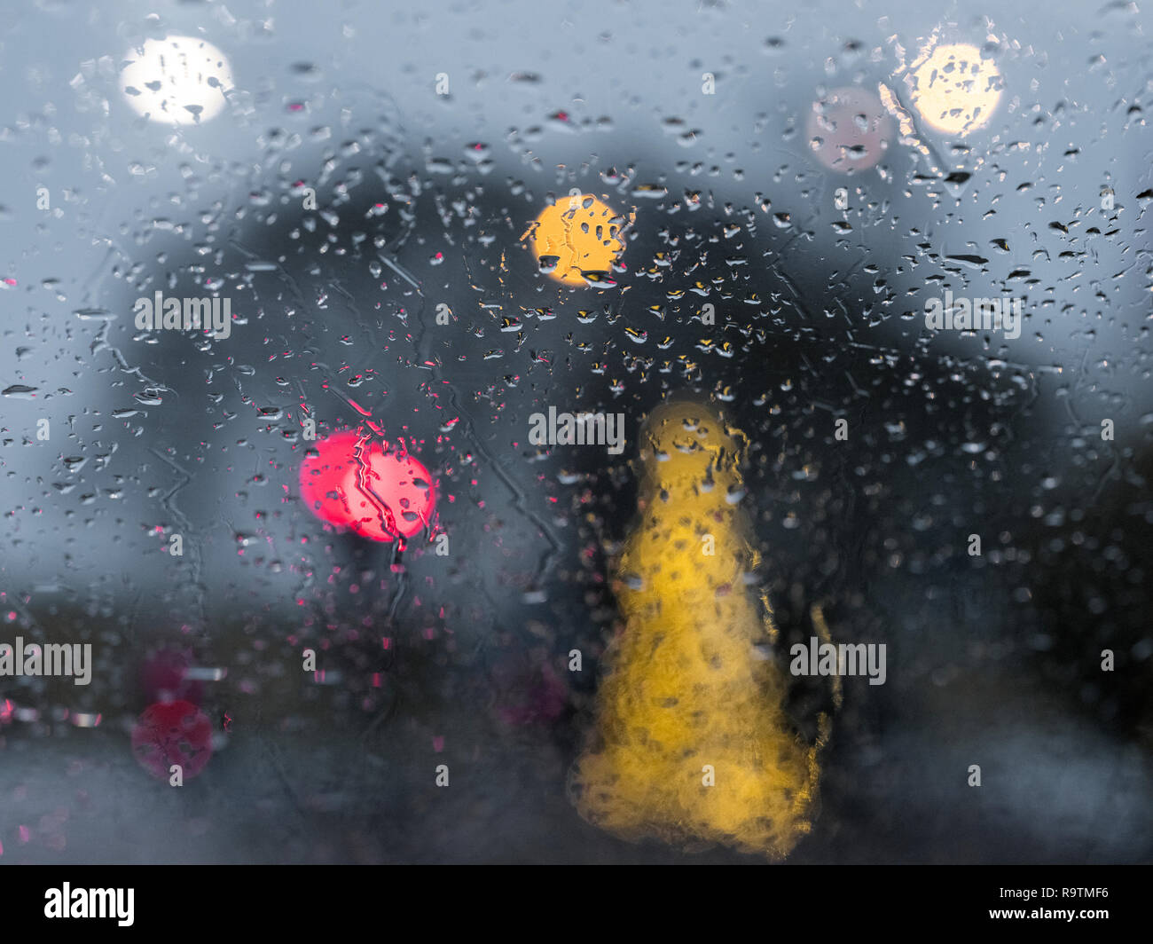 abstract pattern of colorful lights and rain drops during downpour on ...