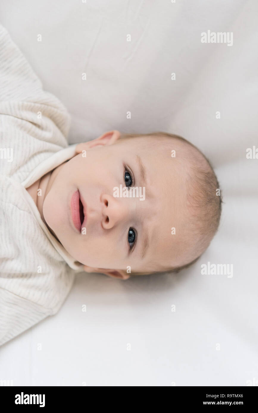 overhead view of adorable baby looking at camera Stock Photo - Alamy