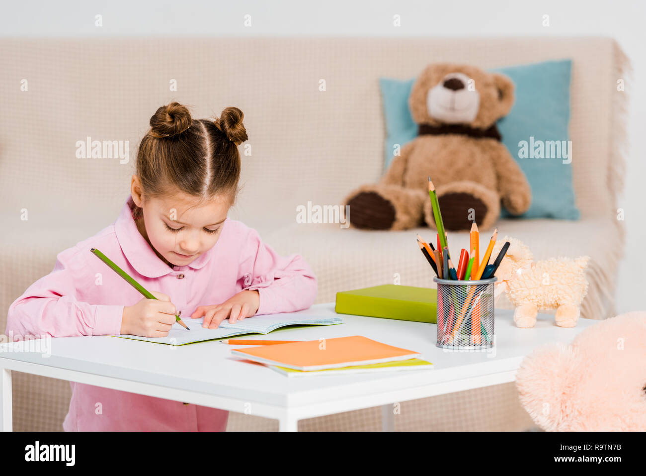 Child writing with pencil hi-res stock photography and images - Alamy