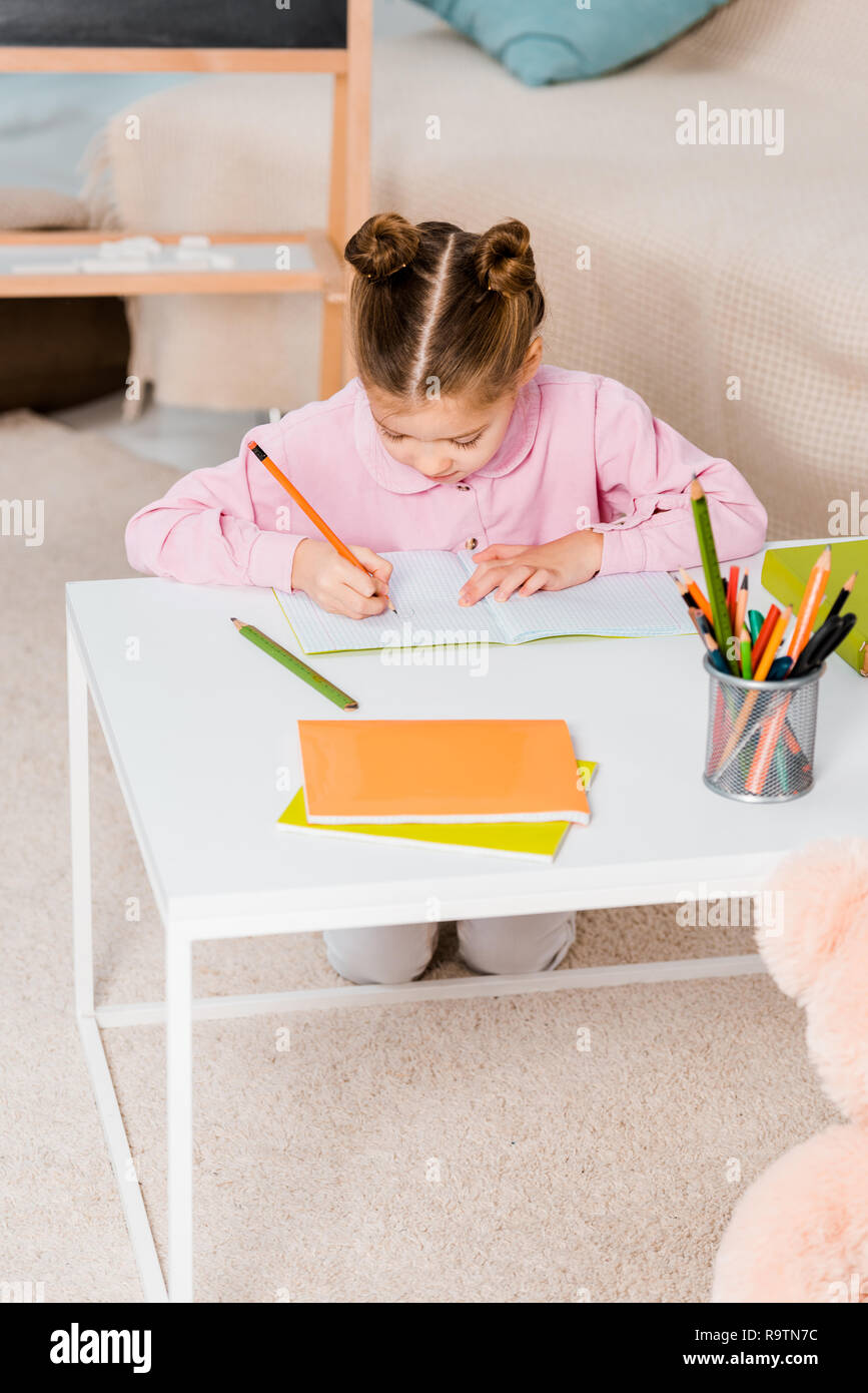Child writing with pencil hi-res stock photography and images - Alamy
