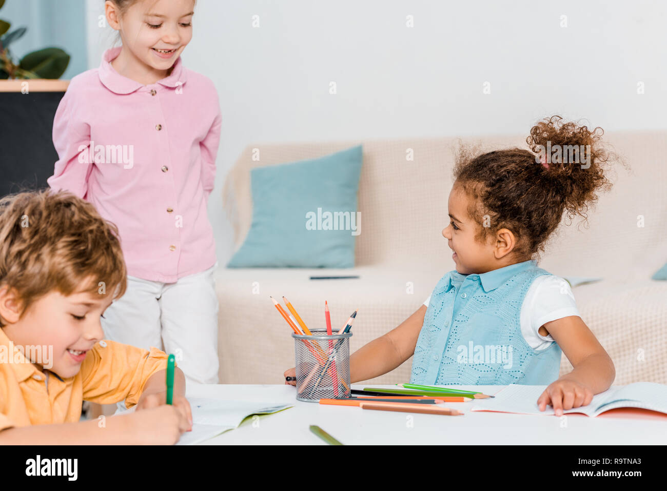 cute happy multiethnic kids drawing together Stock Photo - Alamy
