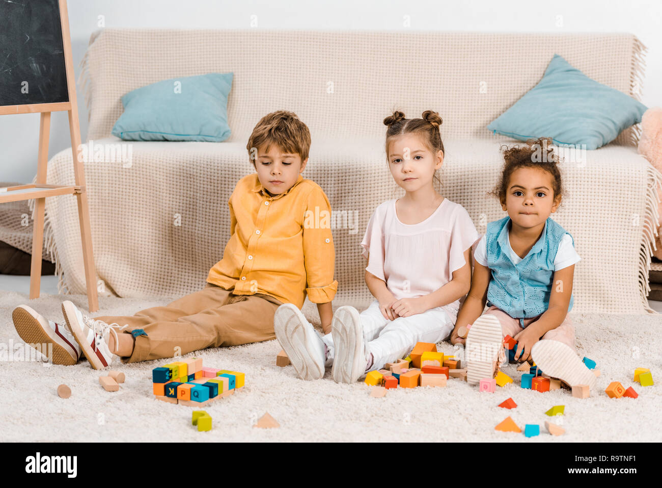 Kids playing cubes hi-res stock photography and images - Alamy