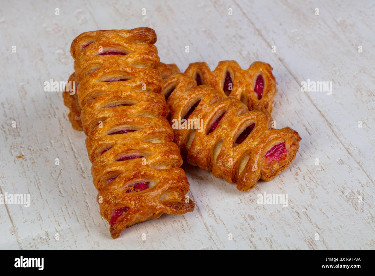Delicious puff pastry strudel with jam Stock Photo - Alamy