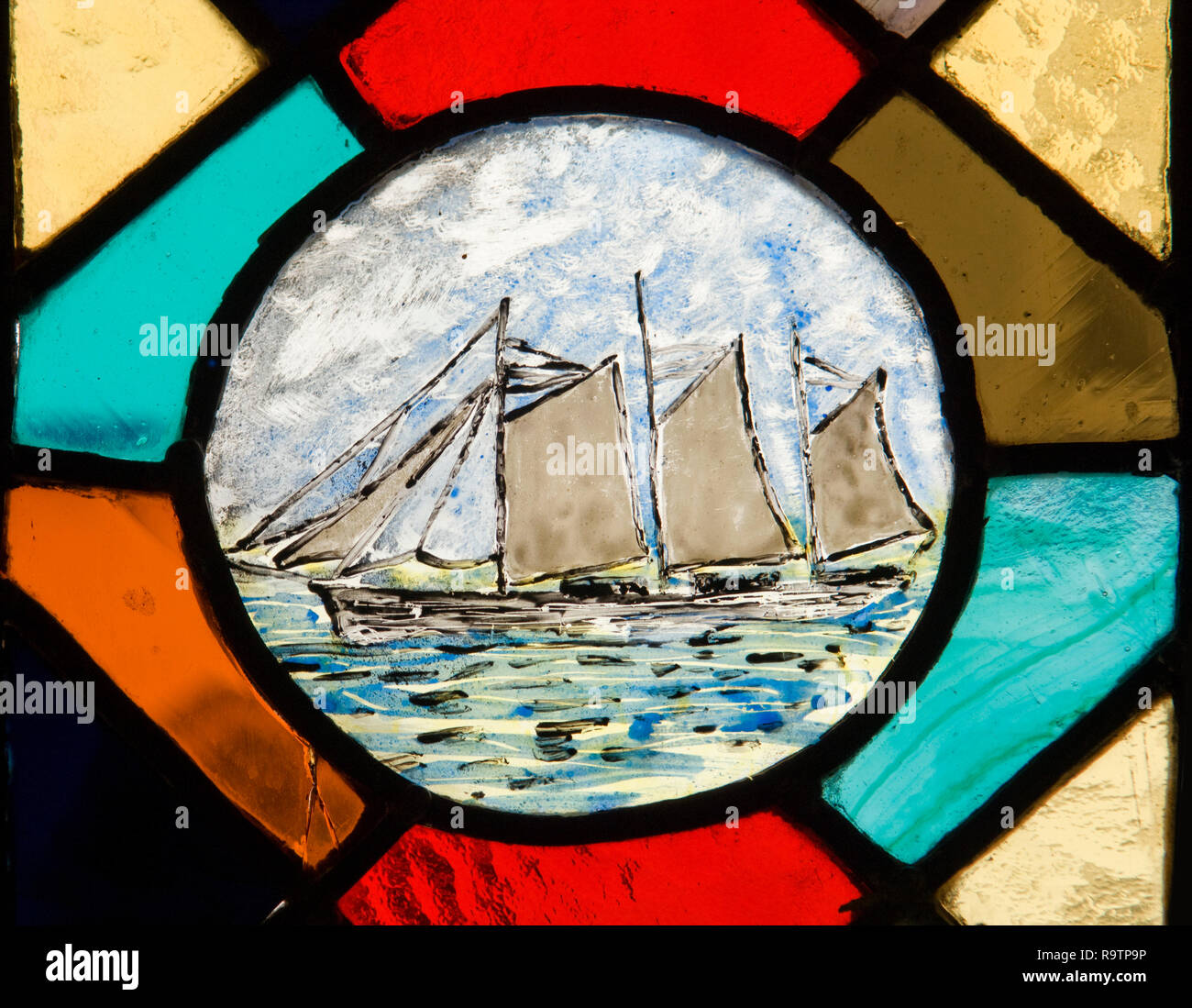A stained glass window showing 3 masted sailing ship Stock Photo - Alamy