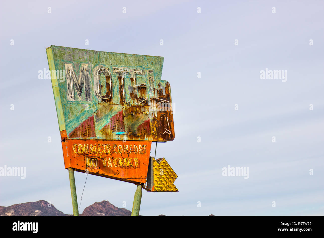 Old Rusty Motel Sign With Broken Neon Stock Photo - Alamy