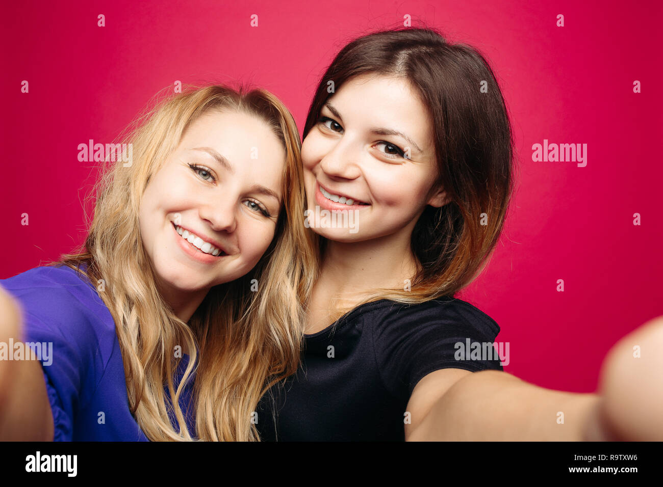 Self portrait of two beautiful, positivity girls, taking photo,smiling ...