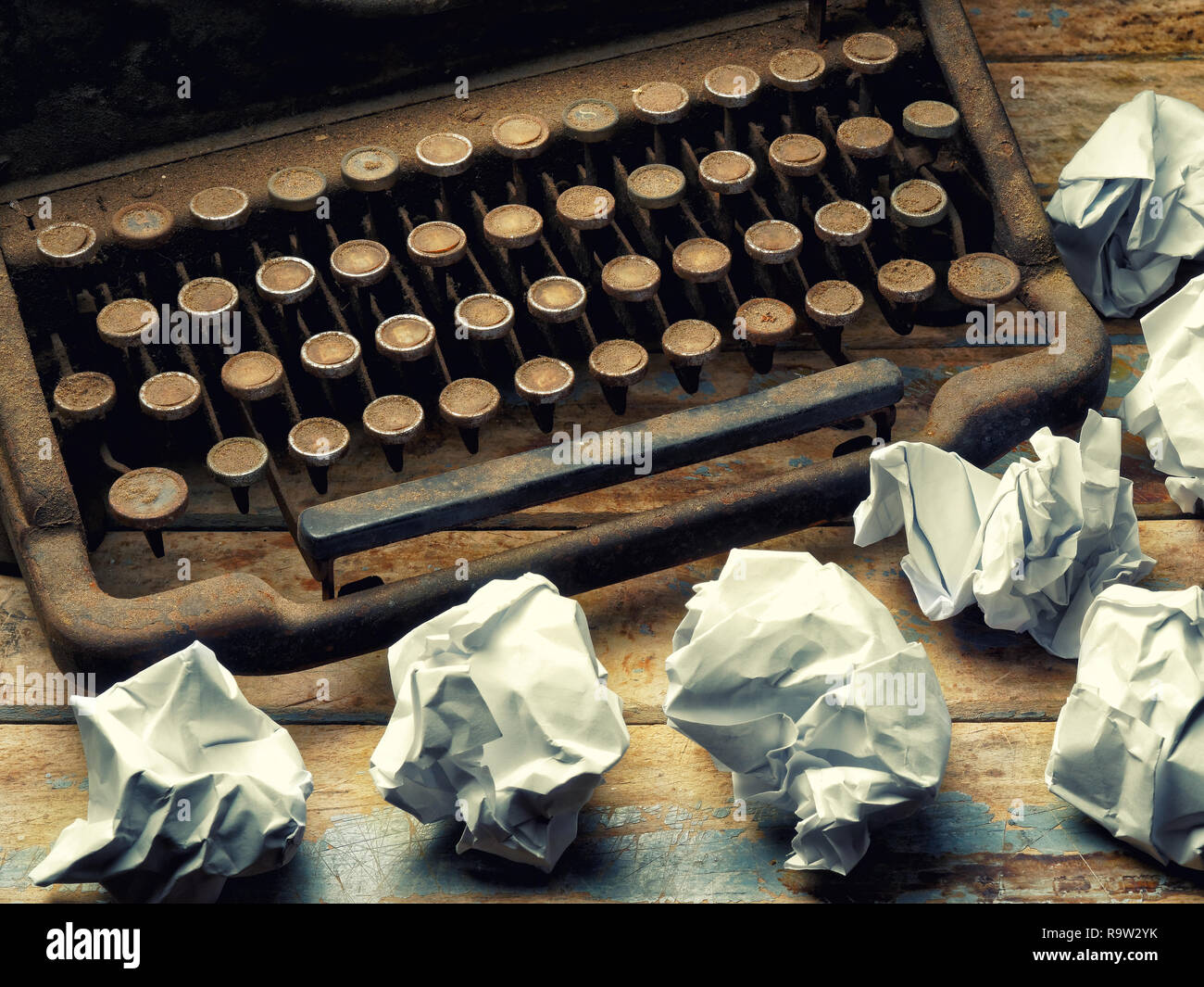 Vintage Typewriter covered desk paper balls close up Stock Photo - Alamy