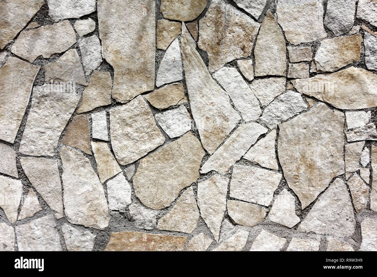 Wall of irregular stones frontal Stock Photo - Alamy
