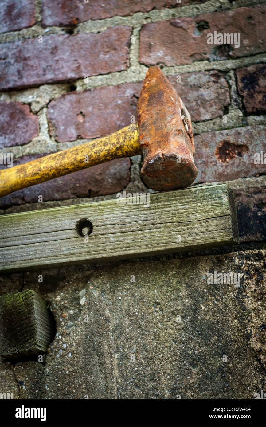 Small single handed worn and rusty sledge hammer construction ...