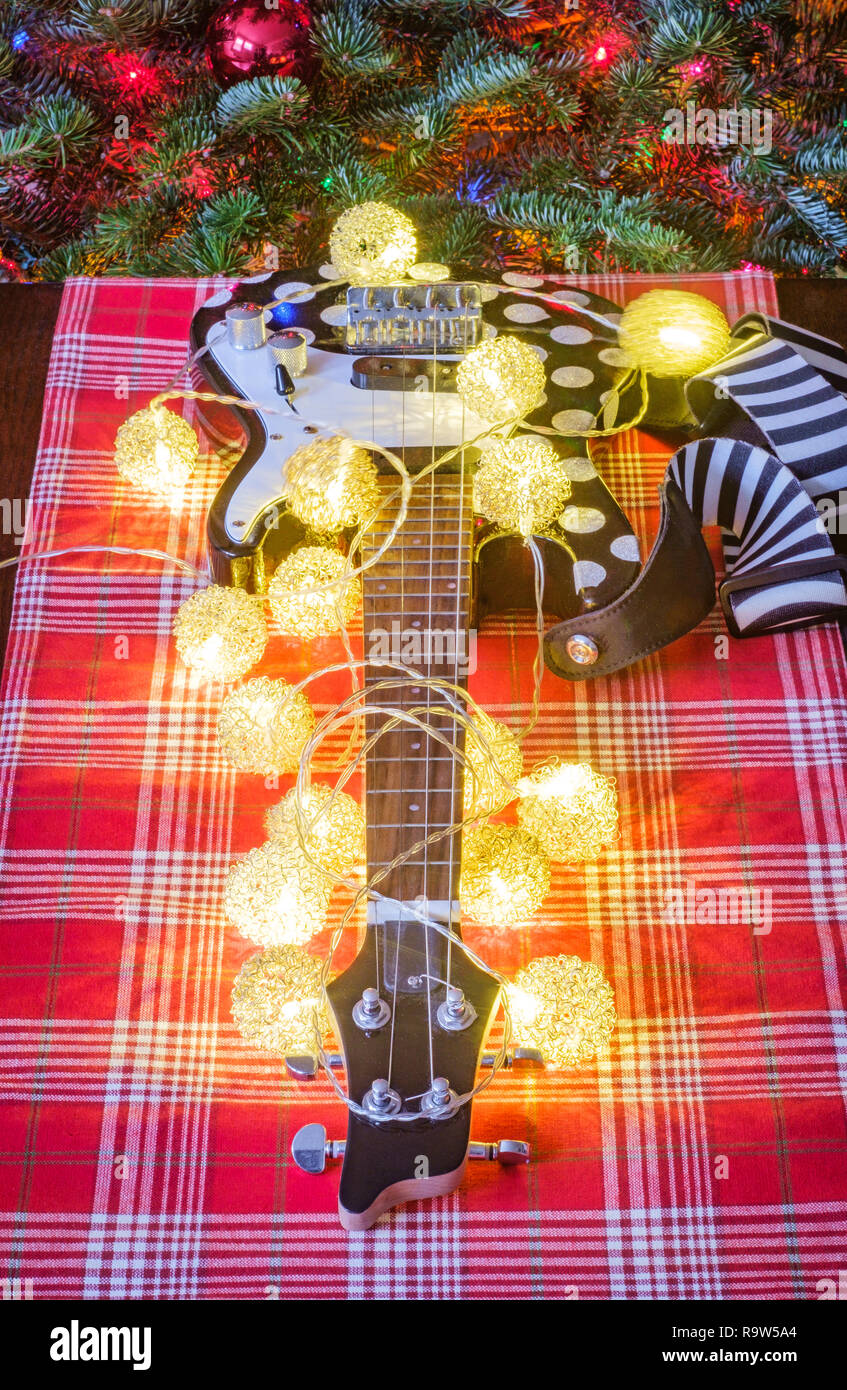 Seasonal holiday musical instrument ukulele with Christmas tree ...