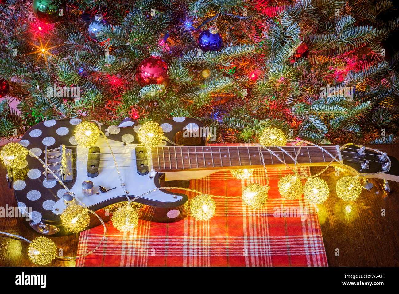 Seasonal holiday musical instrument ukulele with Christmas tree ...