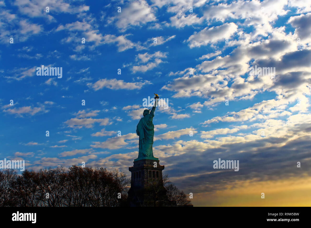 Statue of Liberty New York City back view at dusk or dawn Stock Photo ...