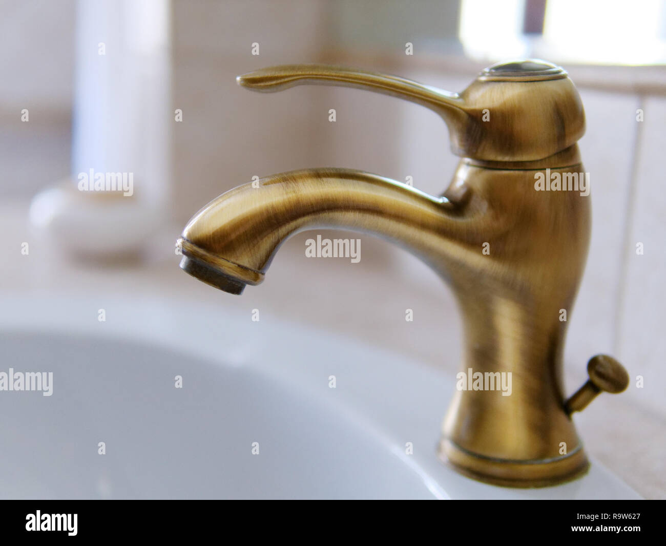 Bronze tap close up Stock Photo - Alamy