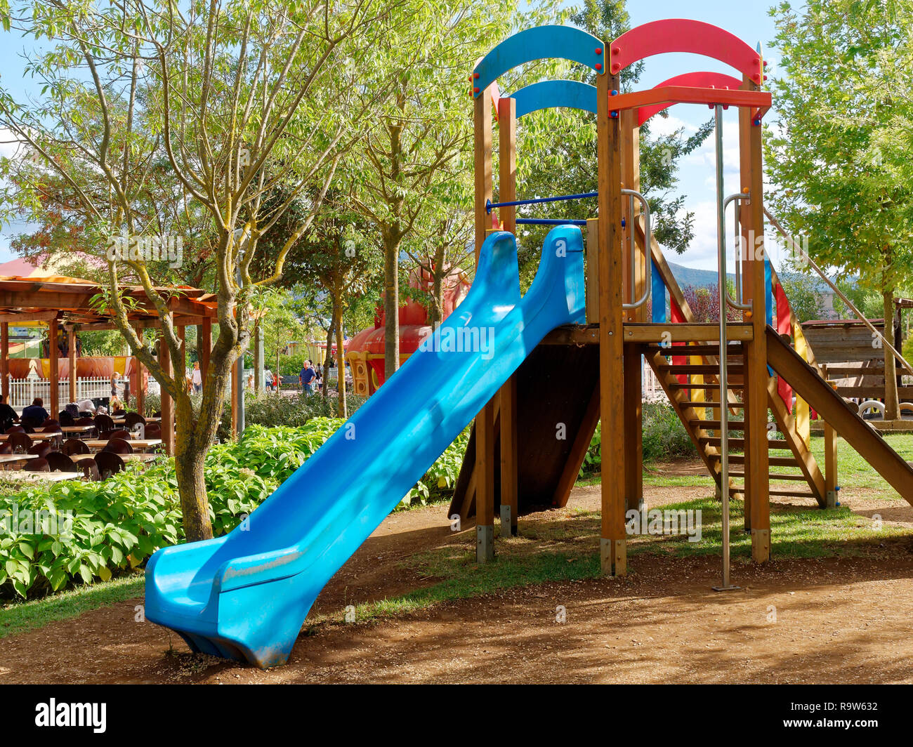 Empty slide swing at park outdoor Stock Photo - Alamy