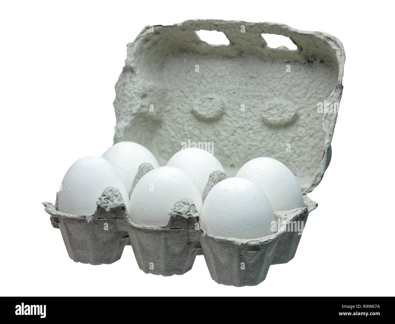 White eggs in container isolated Stock Photo - Alamy