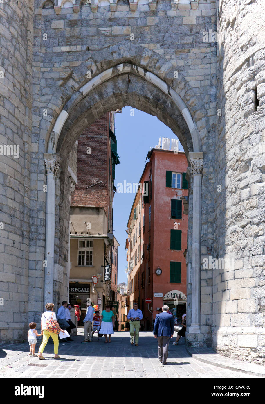 Pedestrians walking through the Towers of Porta Soprana, the best-known ...