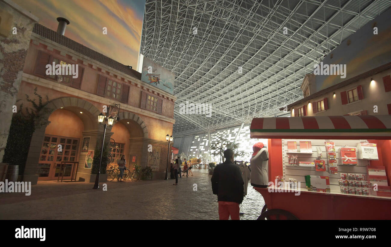 Italian street of cafes and shops in the theme park Ferrari World Abu ...