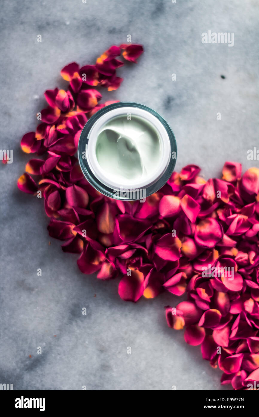 luxe face cream and rose petals - cosmetics with flowers styled beauty ...