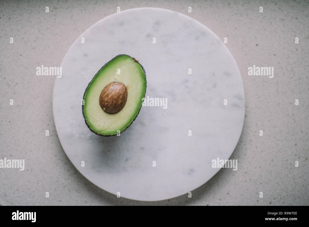 avocado on marble table - organic vegetables and healthy eating styled ...