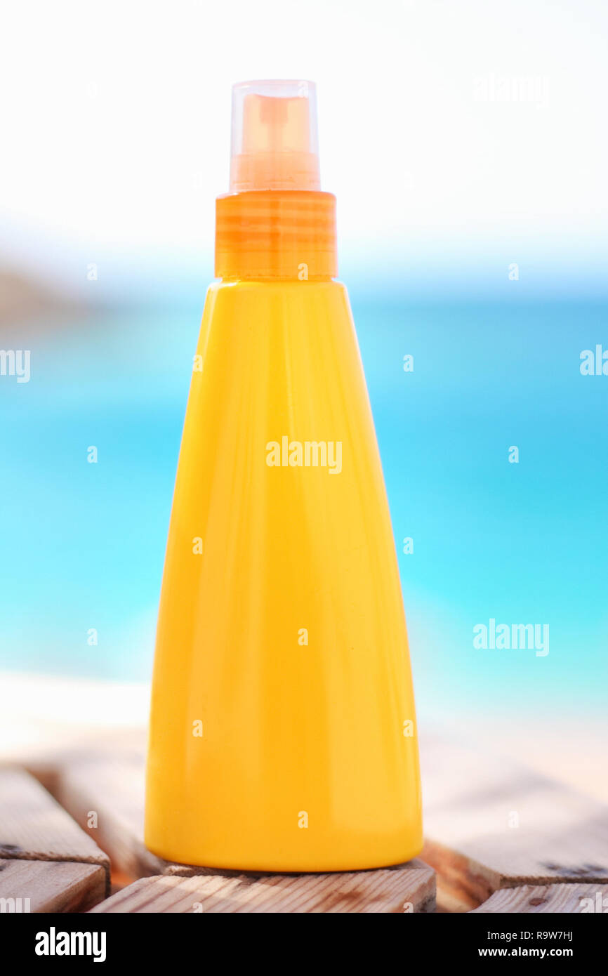 suntan lotion on the beach - summertime, skincare and beauty styled ...