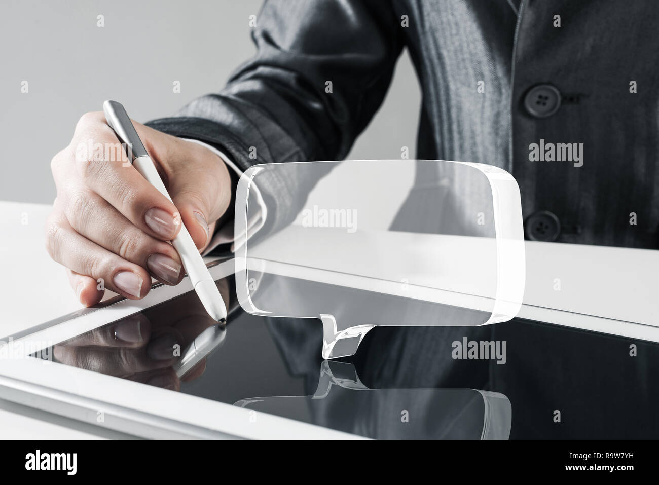 Female hands using graphics tablet and glass icons fly in air. M Stock ...