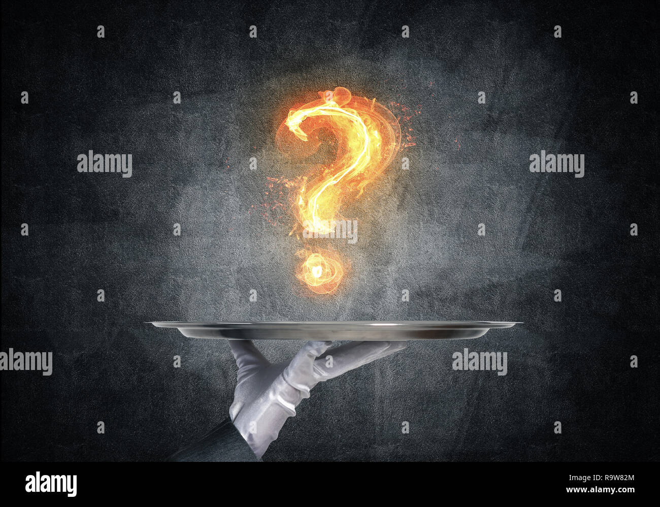 Hand of waitress presenting flaming question mark Stock Photo - Alamy