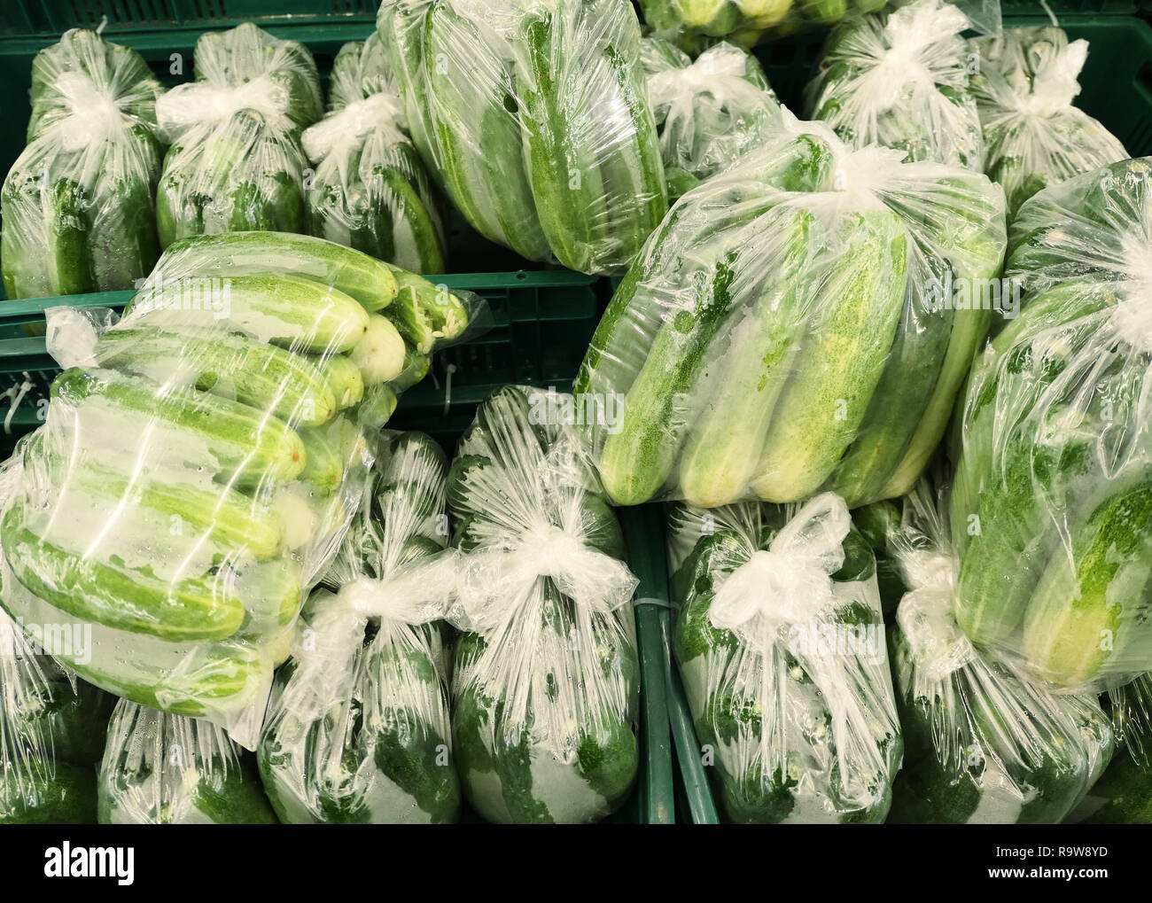 Cucumbers in a plastic bag Stock Photo - Alamy