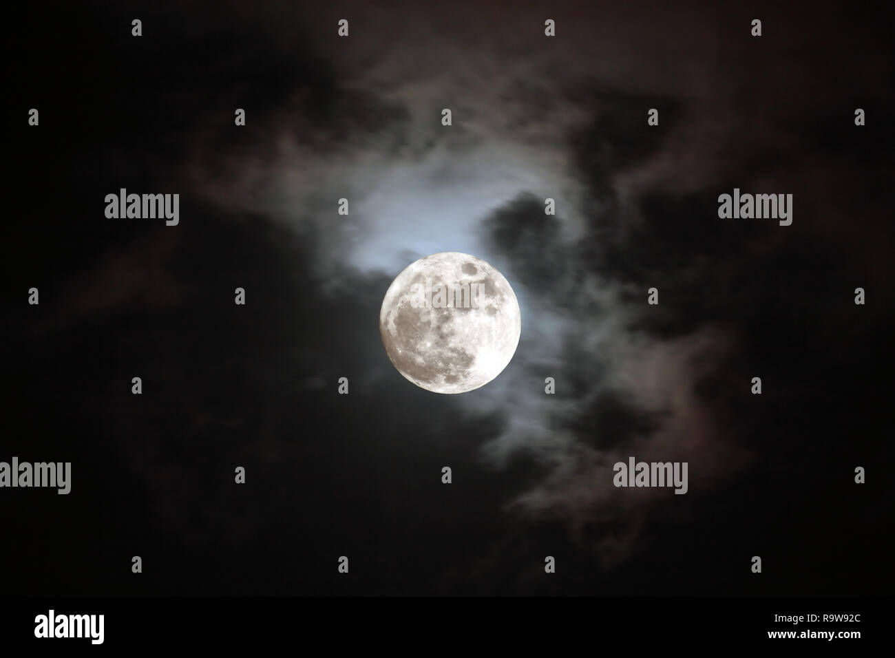 Beautiful full moon in a cloudy night Stock Photo - Alamy