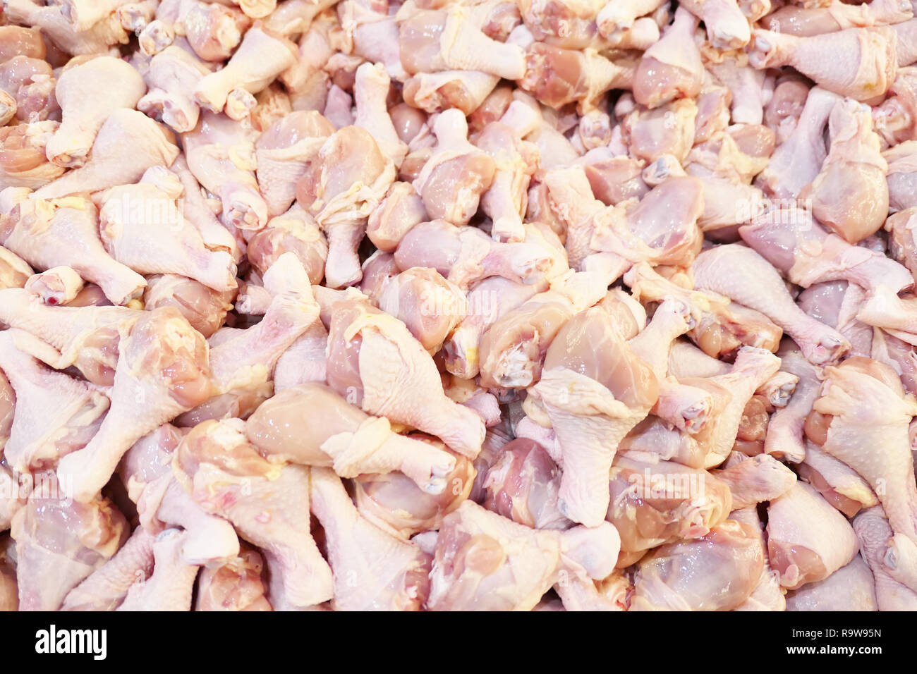Pile of chicken raw legs Stock Photo - Alamy