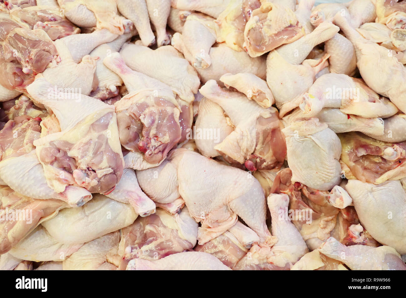 Pile of chicken raw legs Stock Photo - Alamy
