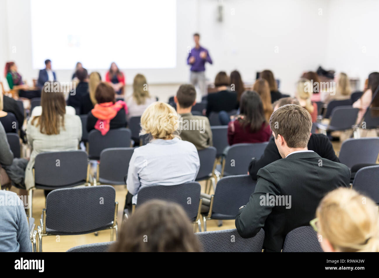 Audience in lecture hall participating at business conference Stock ...