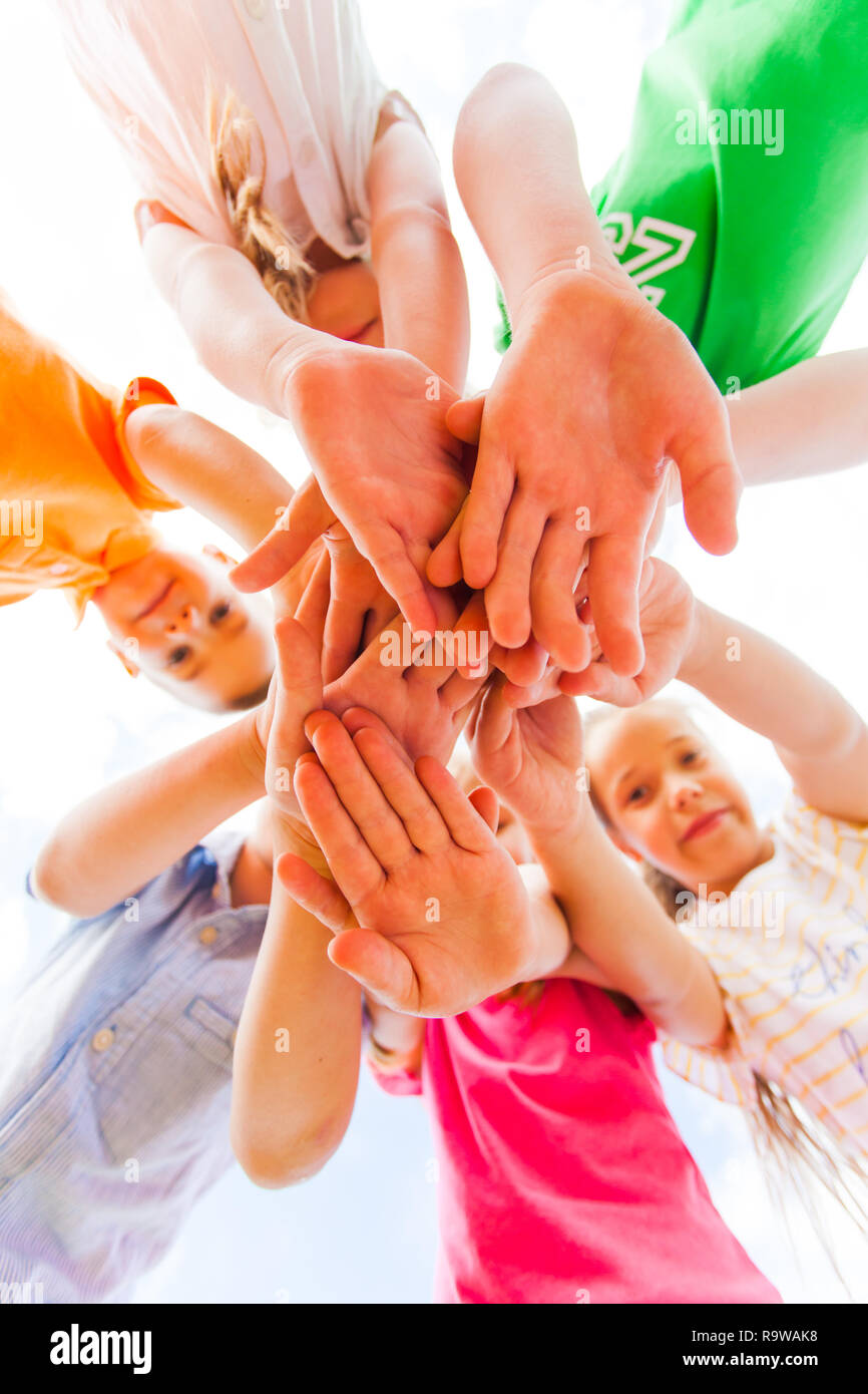 Close view of childrens arms put on each other Stock Photo - Alamy