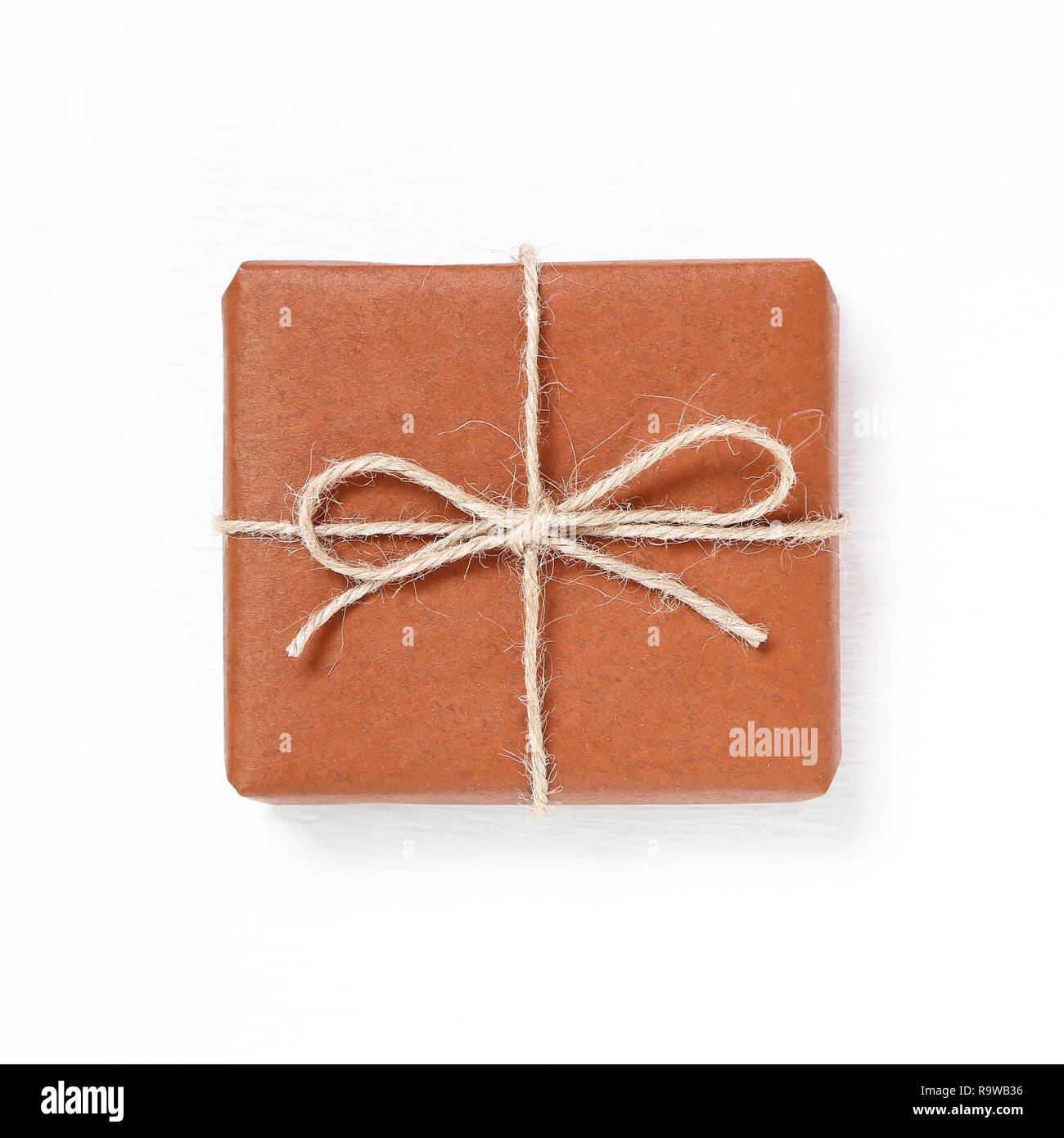 Brown gift box isolated on white background Stock Photo - Alamy