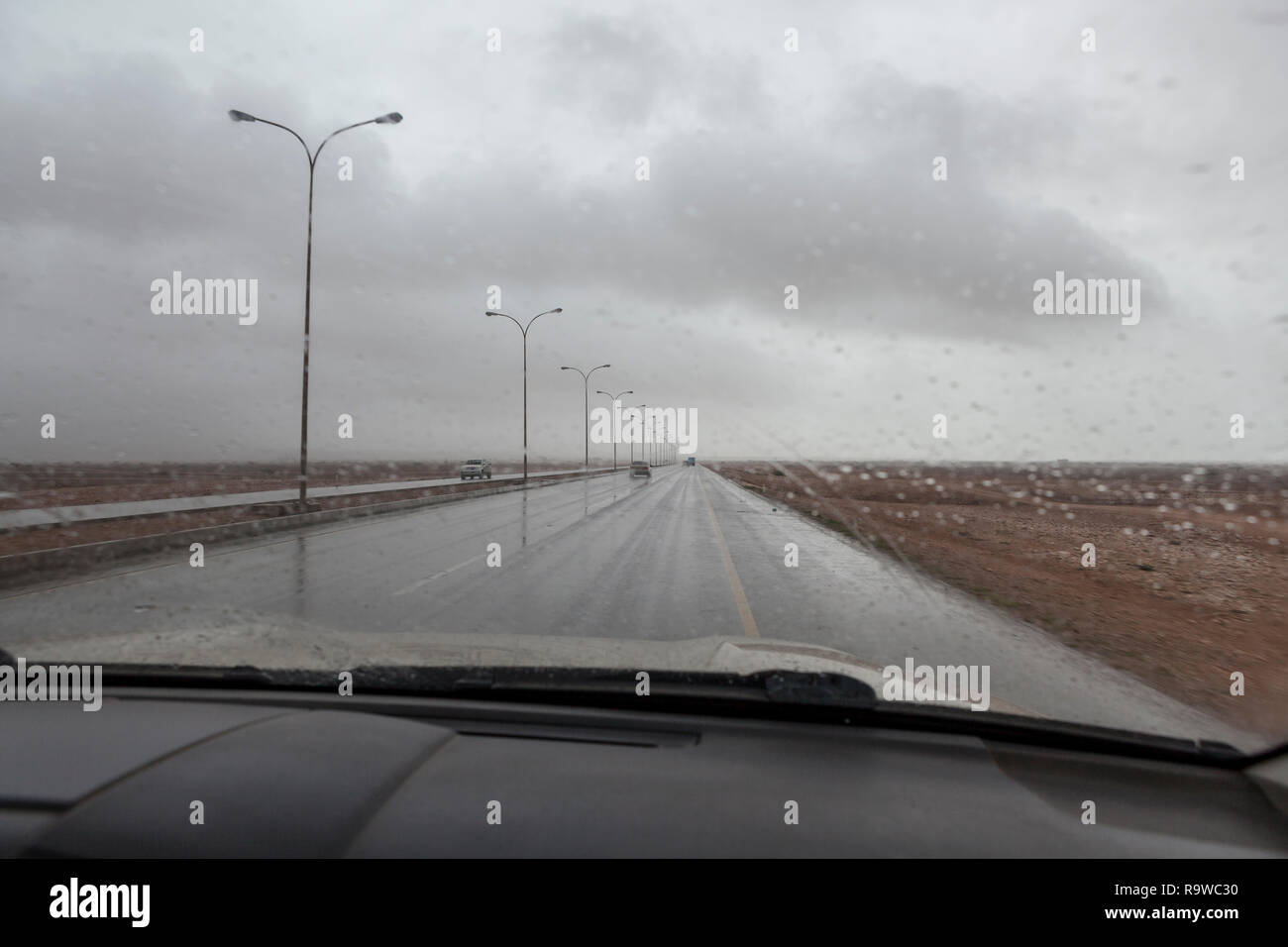 View through a windscreen of a 4x4 during the rainy weather of the ...