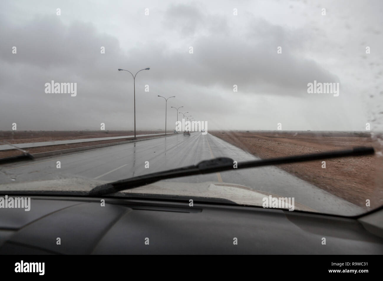 View through a windscreen of a 4x4 during the rainy weather of the ...