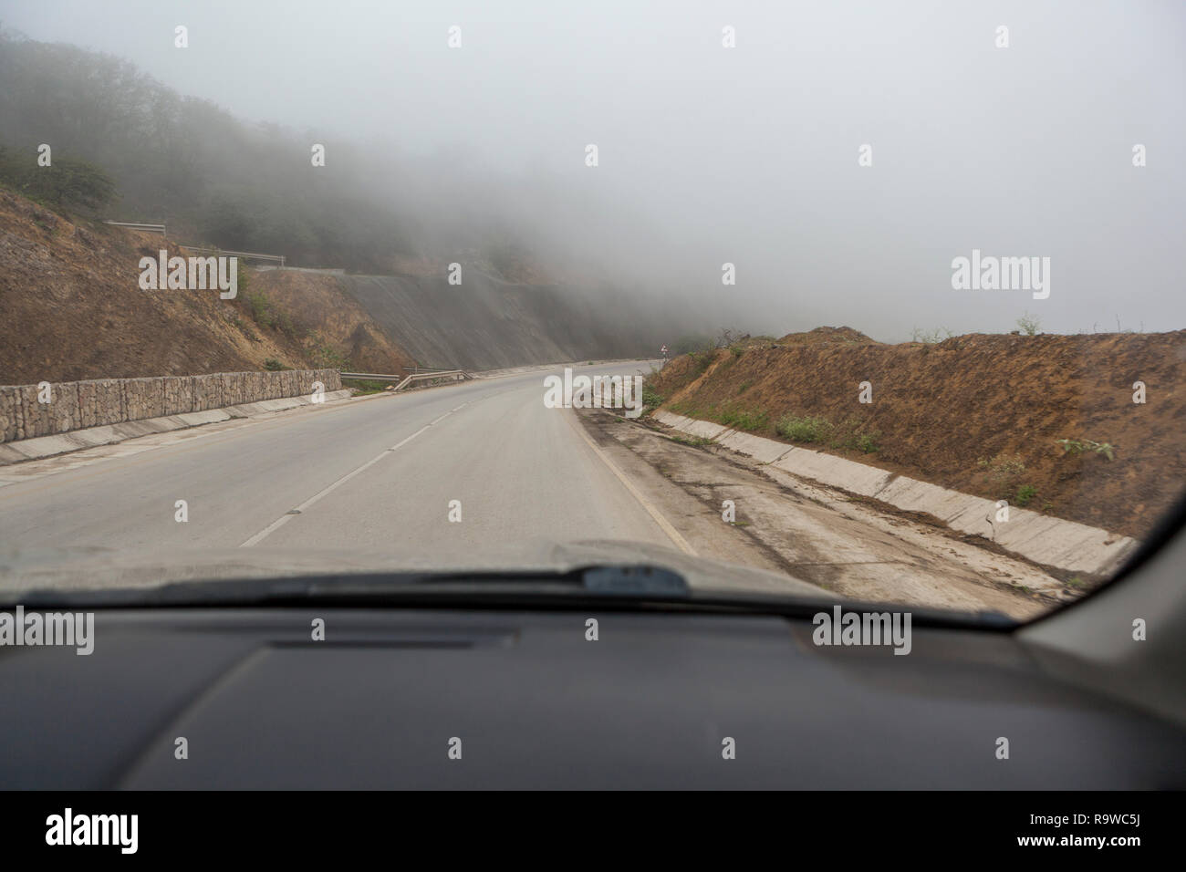 View through a windscreen of a 4x4 during the rainy weather of the ...