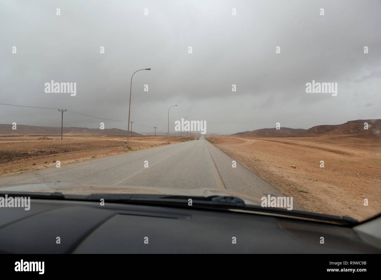 View through a windscreen of a 4x4 during the rainy weather of the ...