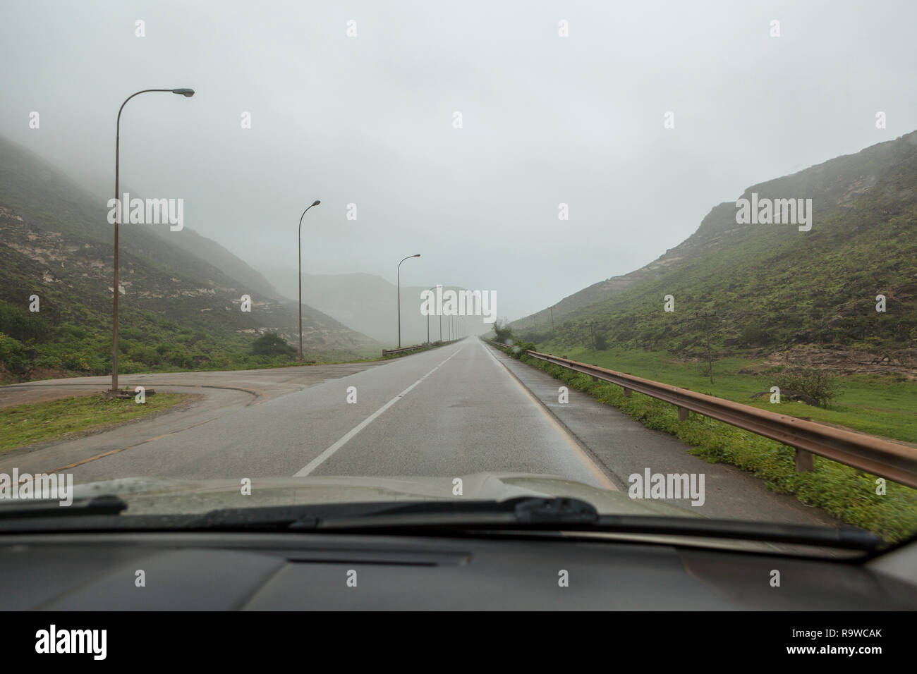View through a windscreen of a 4x4 during the rainy weather of the ...