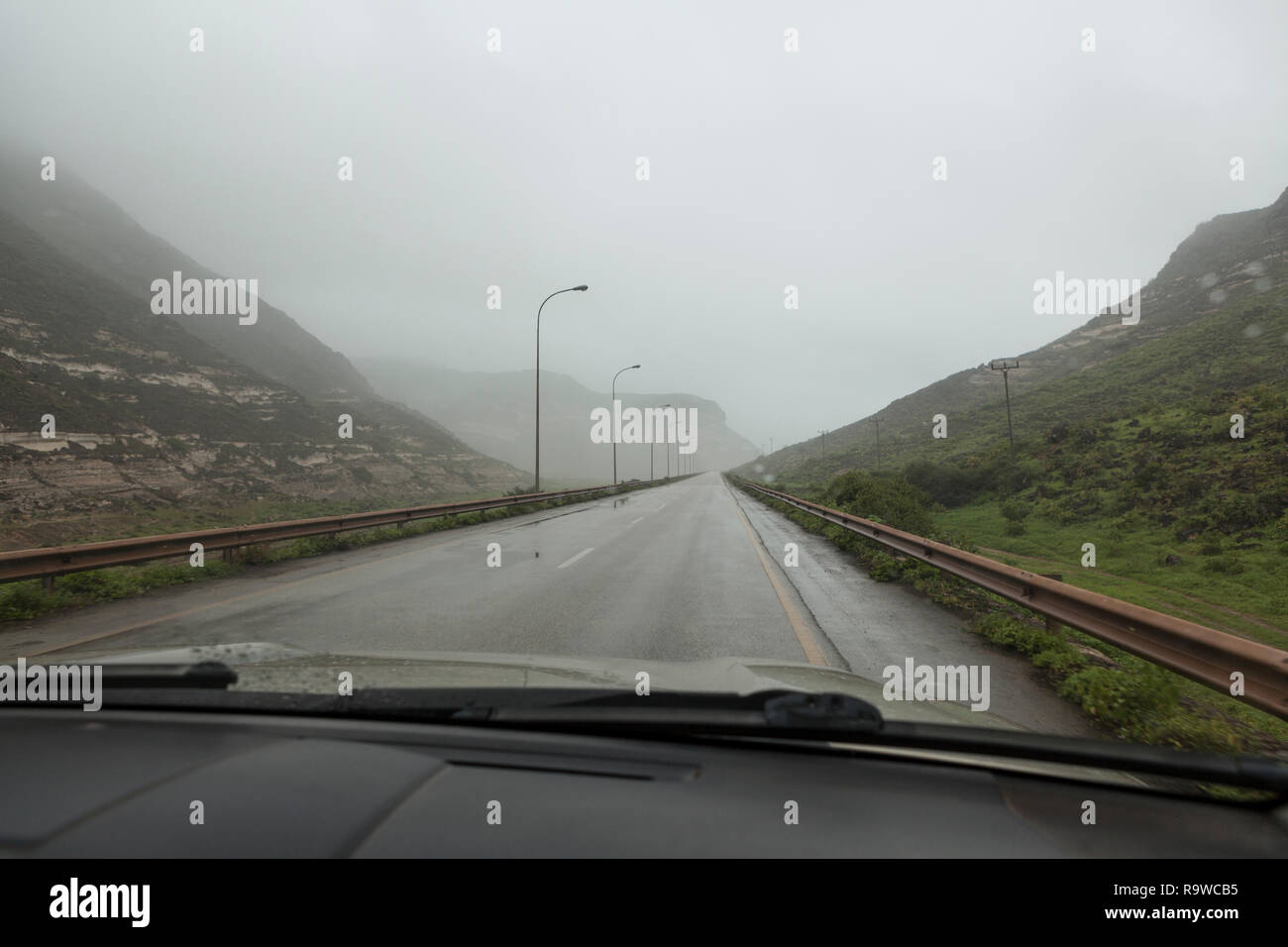 View through a windscreen of a 4x4 during the rainy weather of the ...