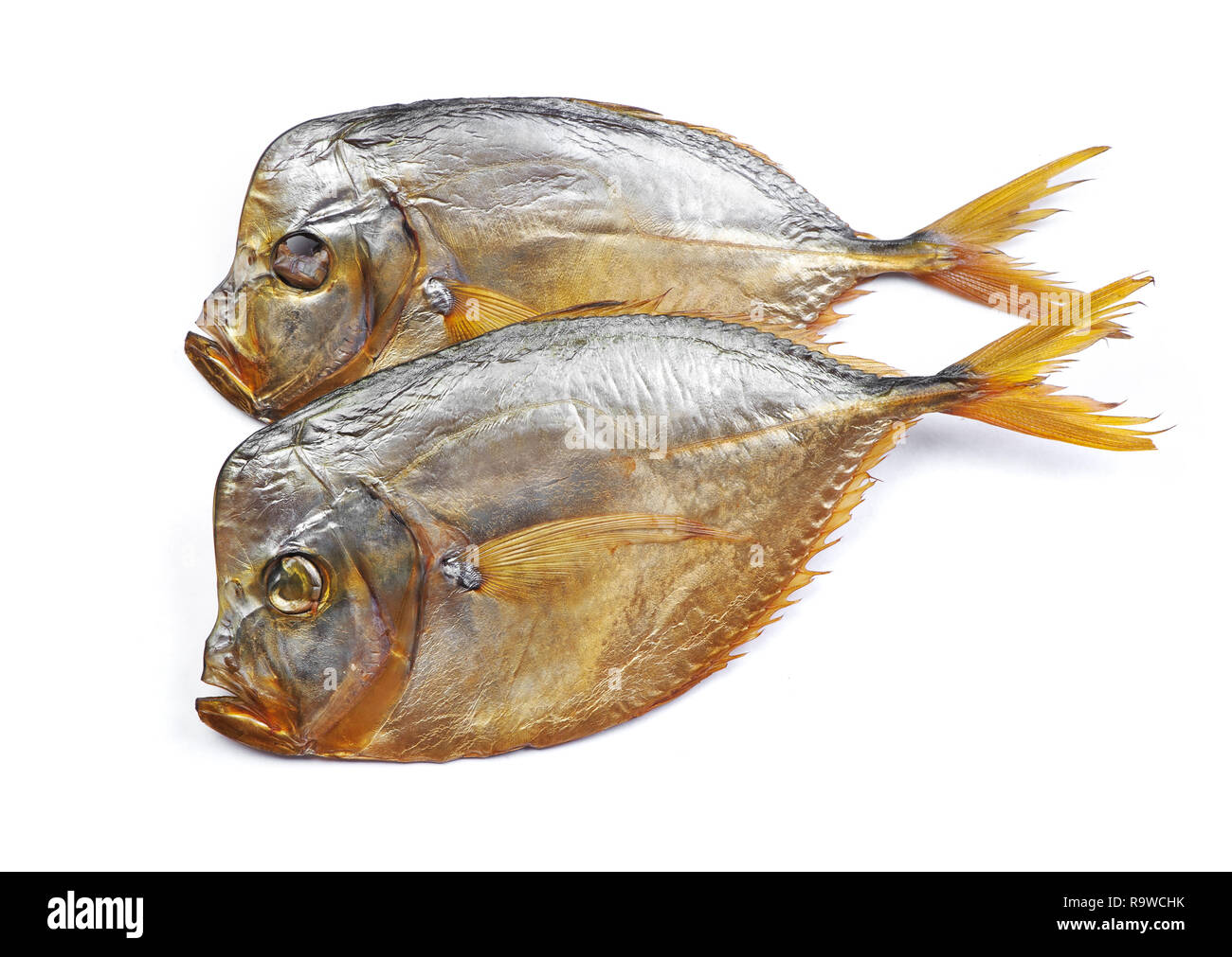 Smoked vomer fish on white isolated background Stock Photo - Alamy