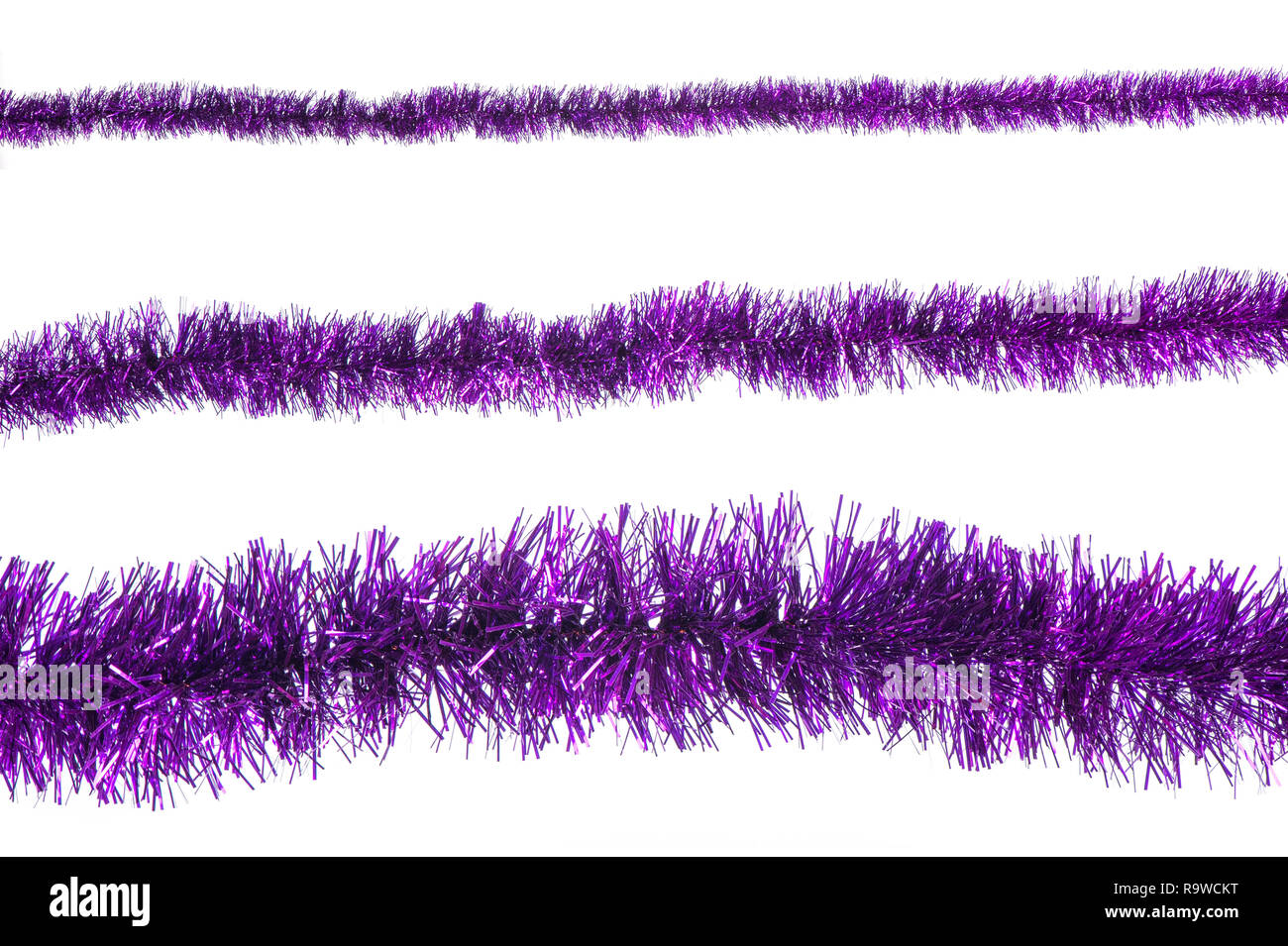 Tinsels in different size isolated on white background Stock Photo - Alamy