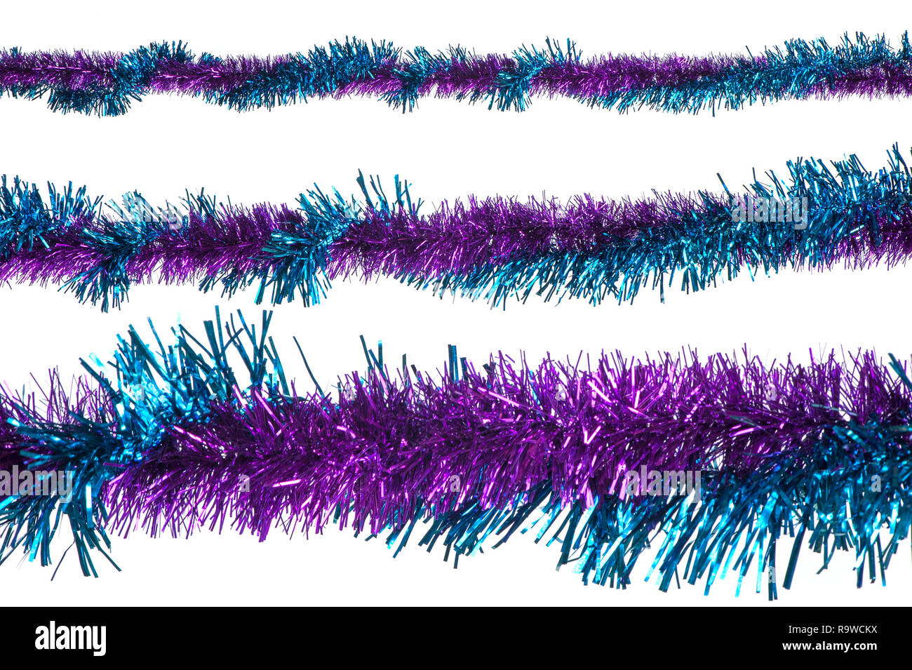 Tinsels in different size isolated on white background Stock Photo - Alamy