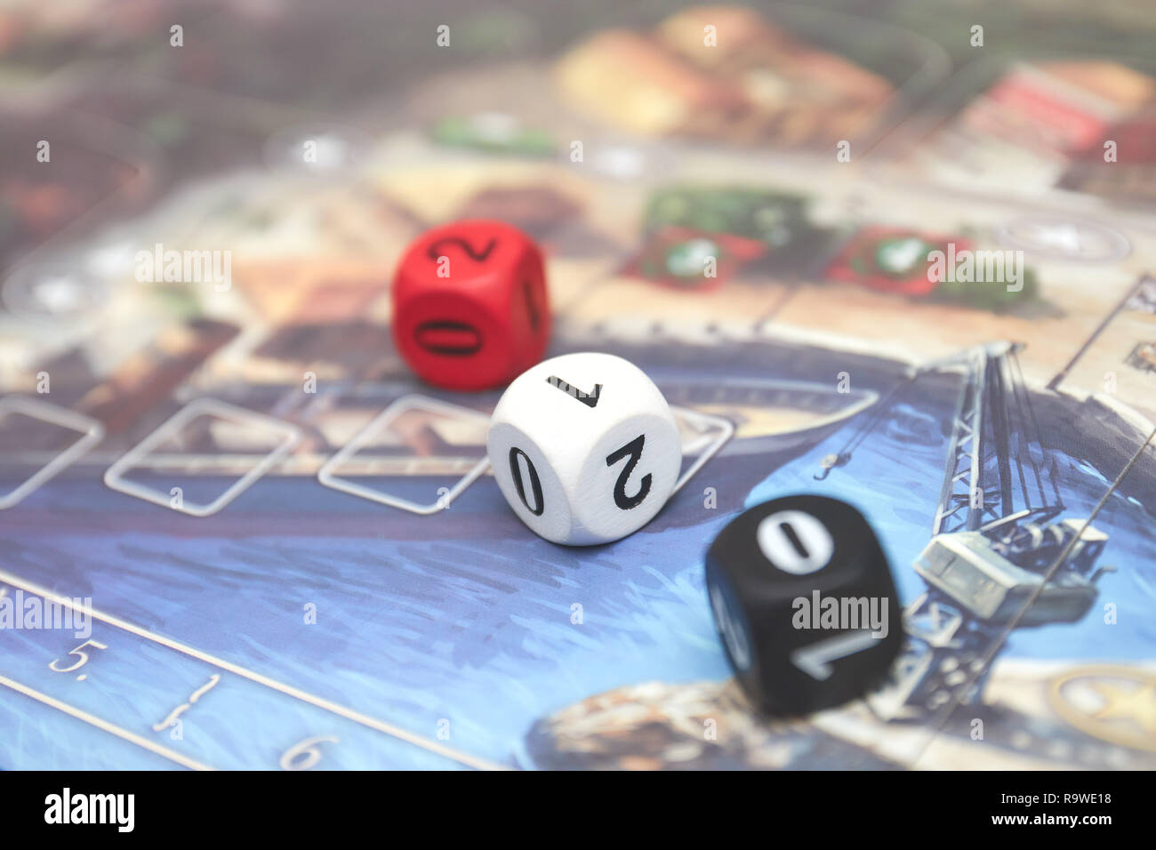 Cubes with the game monopoly on the table Stock Photo - Alamy