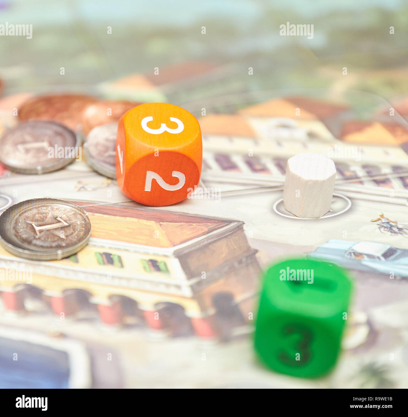Cubes with the game monopoly on the table Stock Photo - Alamy