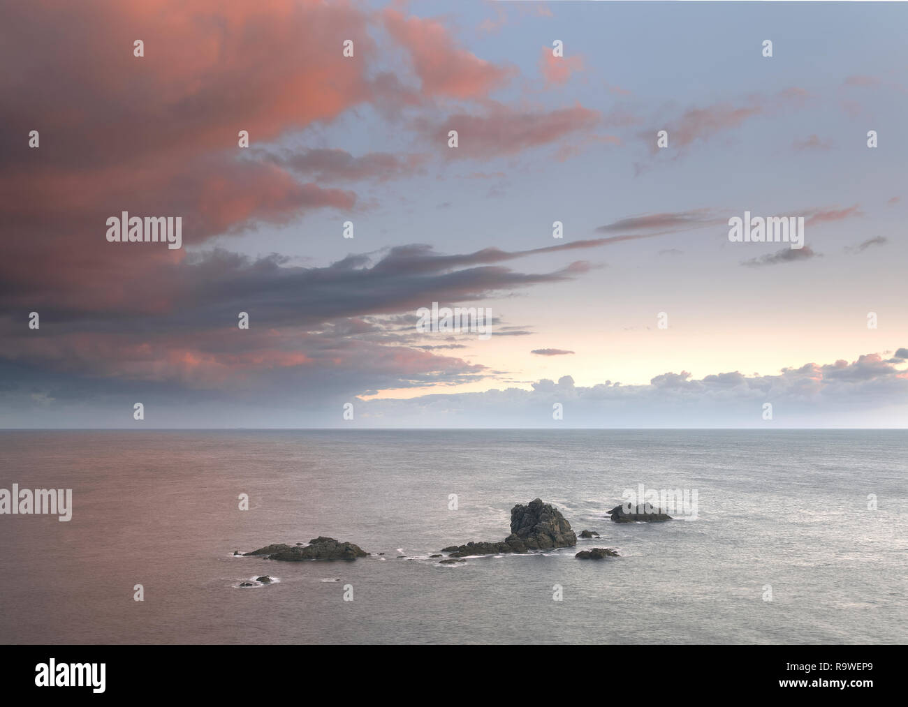 Clouds gathering over Lizard Point at sunset Stock Photo - Alamy